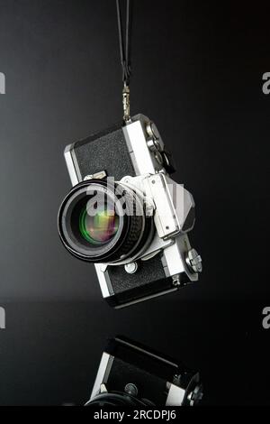 Vintage analog camera with manual flash light isolated on white ...
