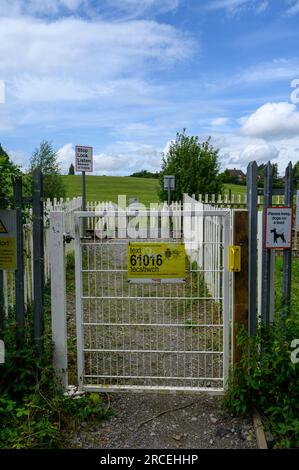 White gate on a pedestrian rail crossing on a UK rail line Stock Photo ...