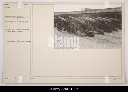 A captured German 105 mm long field gun, identified as NUMBER 67479, is ...