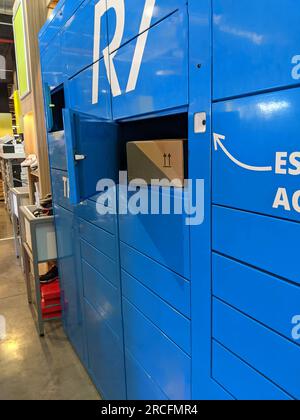 Blue parcel collection lockers in a store Stock Photo - Alamy