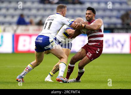 Wigan Warriors' Bevan French (right) celebrates after scoring a try ...