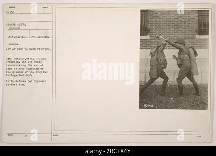 "Mike Gibbons, Middleweight Champion, and Geo. Elake demonstrating hand ...