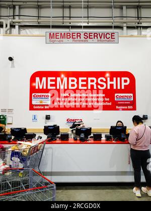 Costco wholesale warehouse membership counter with sign indicating ...