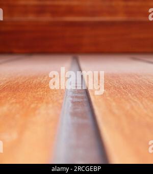 Beautiful warm varnished wooden surface with a dark line in perspective ...