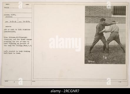 "Mike Gibbons, Middleweight Champion, and Geo. Elake demonstrating hand ...