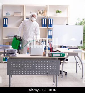 Professional contractor doing pest control at kitchen Stock Photo - Alamy