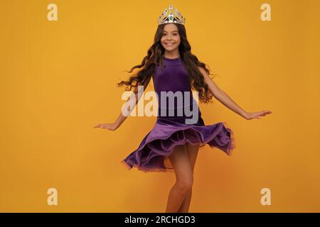 Movement windy dress. Little queen wearing golden crown. Teenage girl ...