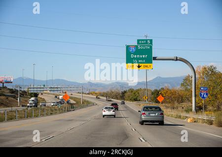 Vehicles on Interstate 76 leading into Denver, Colorado, USA with rocky ...