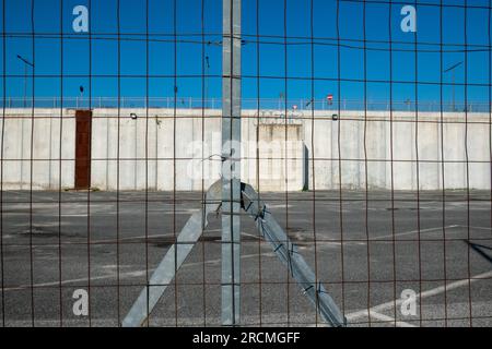 post border with wire mesh. Galvanized posts, anonymous fence. borders ...