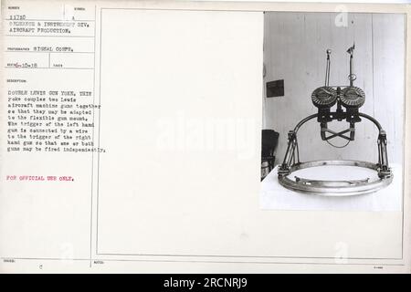 A yoke coupling two Lewis aircraft machine guns together for use in the ...