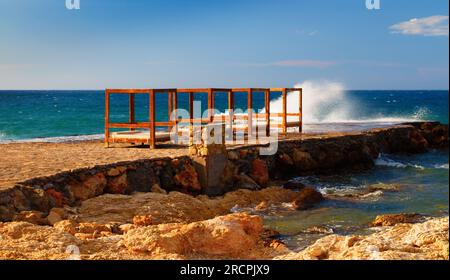 Beach and jetty with pergolas in the resort of Hersonissos on the ...