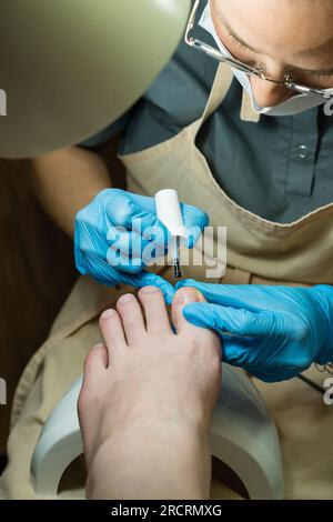 Pedicure. Layer-by-layer application of gel polish components. Nail ...