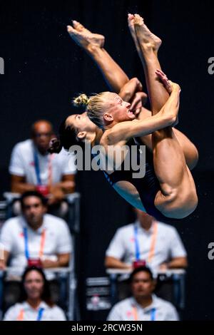 Sarah Bacon and Kassidy Cook, of the United States, compete in the ...
