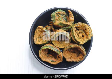 Dry Patra is an Indian dish made with colocasia leaves that are coated ...