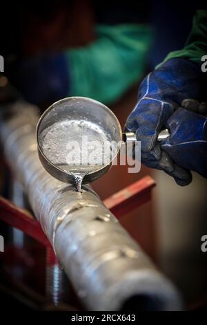 Molten Metal Poured into Mold Stock Photo - Alamy