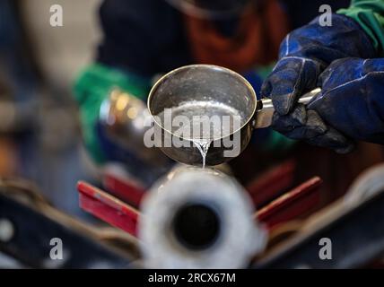 Molten Metal Poured into Mold Stock Photo - Alamy