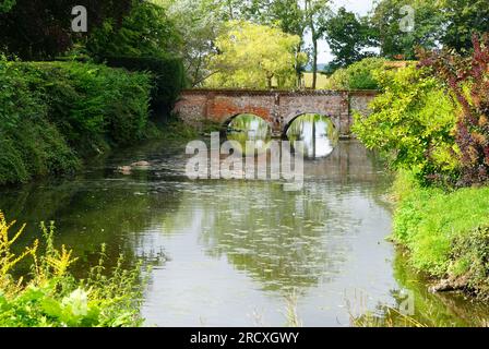 Bridge over the moat at Hindringham Hall Stock Photo - Alamy