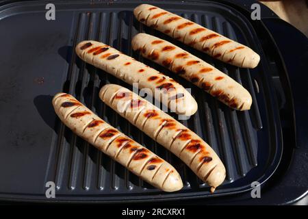 German food. Thuringian white sausage on a barbecue. Thuringia region ...