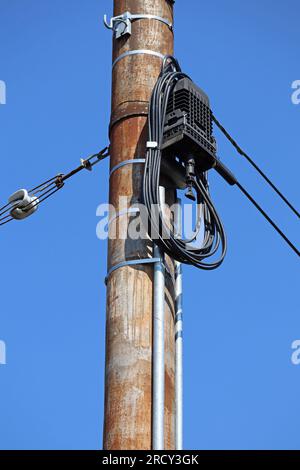 Internet router on a pole outdoor with cables Stock Photo - Alamy