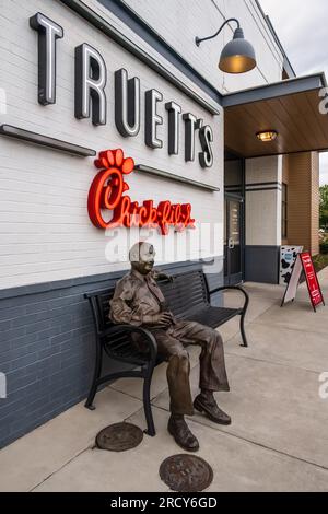 Bronze statue of Chick-fi-A founder, Truett Cathy, in front of Truett's ...
