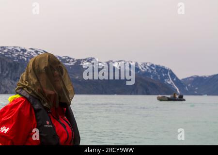 woman wearing mosquito net at Kvanefjord, Greenland in July Stock Photo ...