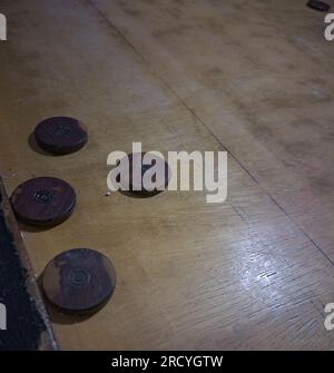 wooden carrom pieces lying on polished board with striker Stock Photo ...