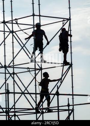 workers building a stage with scaffolding Stock Photo - Alamy