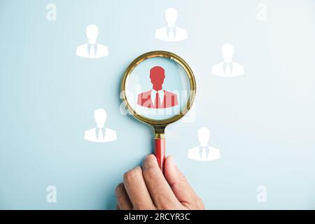HRM insight Magnifier glass zooms in on manager icon in staff icons ...
