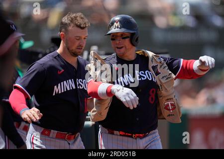 Minnesota Twins' Christian Vazquez, right, is congratulated by Carlos ...