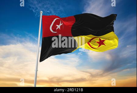 official flag of Muar, Johor Malaysia at cloudy sky background on sunset, panoramic view ...