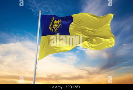 official flag of Standard of the Raja Permaisuri Agong Malaysia at cloudy sky background on ...