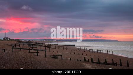 Moody sunrise from the coast at Pevensey bay east Sussex south east ...