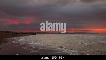 Moody sunrise from the coast at Pevensey bay east Sussex south east ...