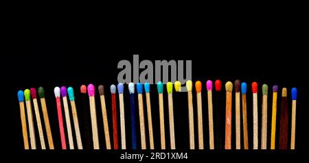 matchsticks of various shapes and colors on black background Stock ...