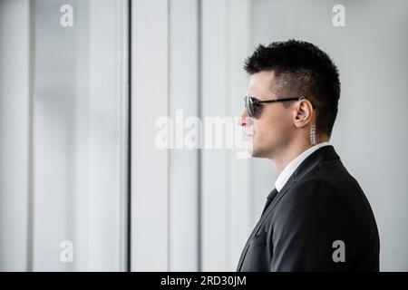 professional headshots, bodyguard work, side view of handsome man in ...