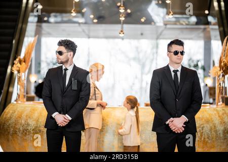 personal security, handsome bodyguards in suits and sunglasses ...