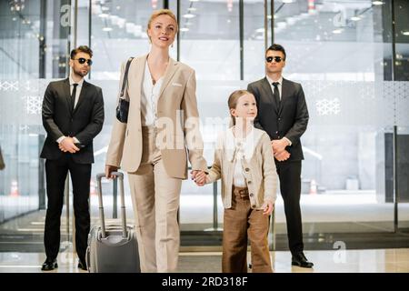 personal security and protection, two bodyguards in suits and ...