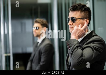 Private security guards stand in the entrance of the Imperial ...