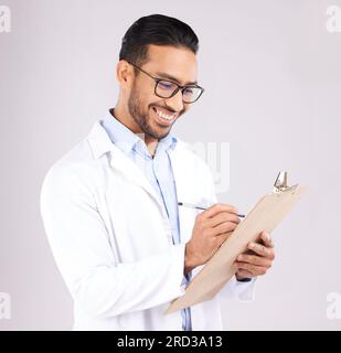 Asian healthcare worker writing medical notes documentation at desk in ...