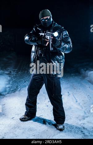 Strong man military special forces standing with gun at night Stock ...