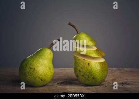 Pear cut into slices whose slices seem to float Stock Photo - Alamy