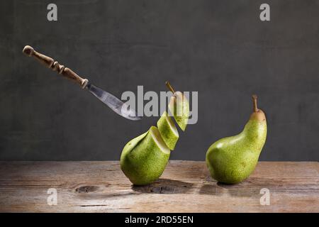 Flying knife cuts pears into floating slices Stock Photo - Alamy