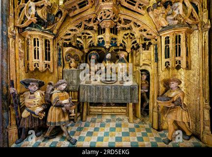 Central carved winged altar with predella, above Crucifixion of Jesus ...