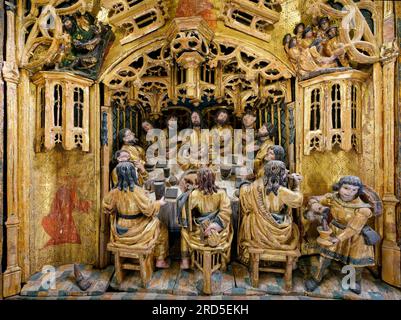 Central carved winged altar with predella, above Crucifixion of Jesus ...