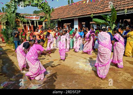 Women clapping hands folk dance called kummi during Pongal celebration ...