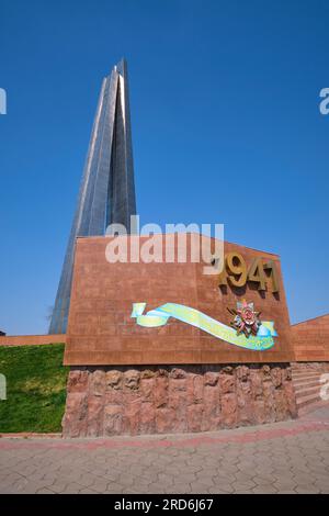 The large, abstract, silver, metal stele monument, dedicated to the ...
