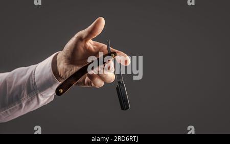 hand hold hairsdresser razor blade in studio. photo of hairsdresser ...