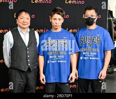 Naoya Inoue (center) of Japan poses with his trainer and father Shingo ...