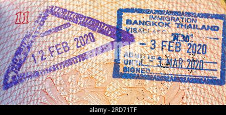 Entry and exit visa stamps of Thailand on a page in a passport Stock ...