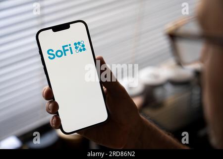 The SoFi bank logo is seen on a mobile device screen in this ...